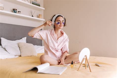 Happy Cute Woman With Patches And Holding Face Massager Stock Image