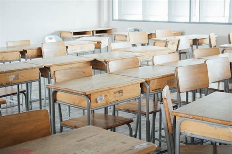 Premium Photo Empty Chairs And Tables In Classroom