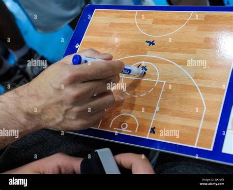 A Person S Hand With A Marker Taking Notes On A Football Field Board