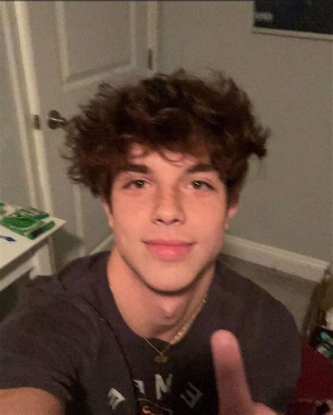 A Young Man Giving The Thumbs Up Sign