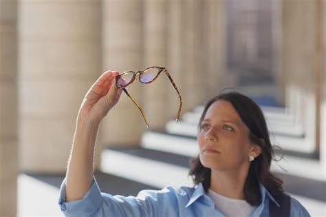 Premium Photo Woman Holds Eyeglasses In Hands Optics Contact Lenses