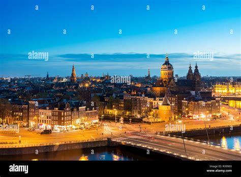 Amsterdam Skyline In Historical Area At Night Netherlands Ariel View