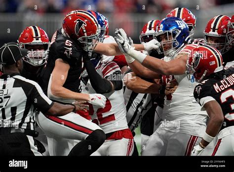 Atlanta Falcons Wide Receiver Drake London 5 And New York Giants Defensive End Elijah Garcia