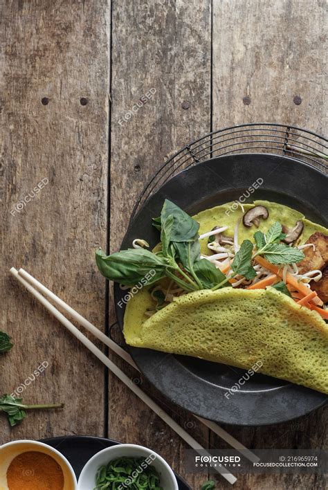 Vietnamese Savory Fried Pancake With Vegetables On Plate On Wooden