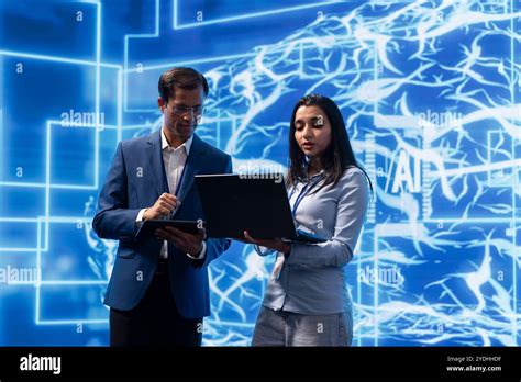 ai researcher and colleague working with artificial intelligence neural