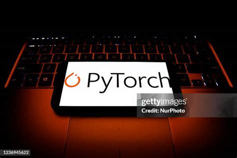 Pytorch Logo Displayed On A Phone Screen And A Laptop Keyboard Are News Photo Getty Images