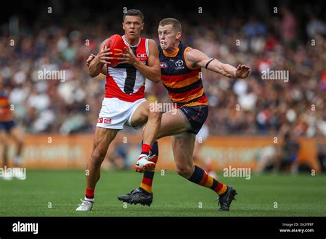 Marcus Windhager of the Saints is tackled by Reilly O'Brien of the ...