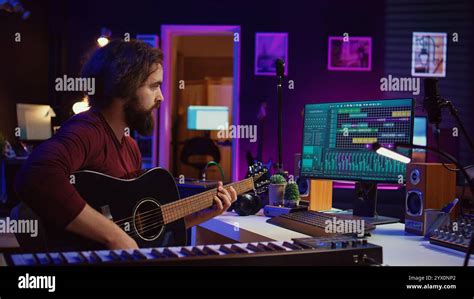Music Producer Mixing Guitar Sounds Played By Him On Acoustic