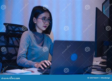 Asian Woman Software Development Working On Coding Computer Screen And Flowchart At Night In