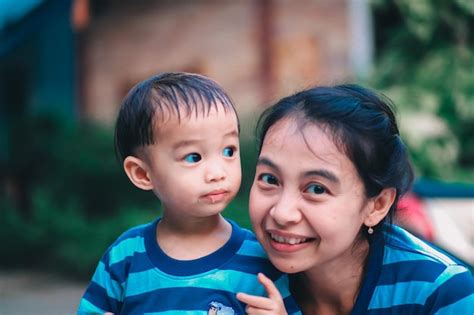 Premium Photo Portrait Of Smiling Mother And Son