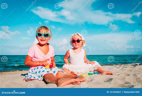 Cute Girls Play With Sand On Summer Beach Stock Image Image Of