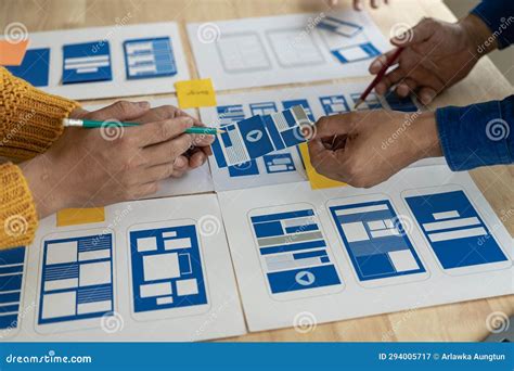 A Team Of Web Designers With The Ux Ui System Are Writing Programs And Layers To Customize The