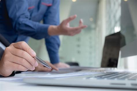 Premium Photo Cropped Hand Of Computer Programmers Brainstorming In Office