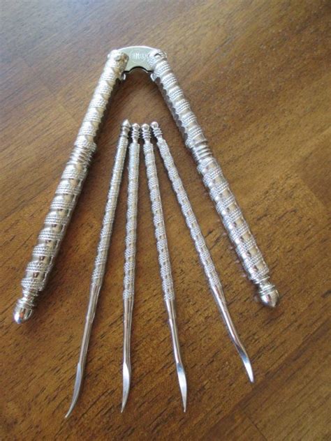 Vintage Hmq Metal Nutcracker With Four Picks
