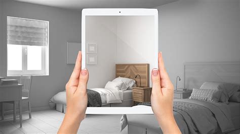 손을 잡고 현대 나무 침실 총 빈 프로젝트 배경 증강 현실 개념 가구 및 인테리어 디자인 제품을 시뮬레이션 하는 응용 프로그램을