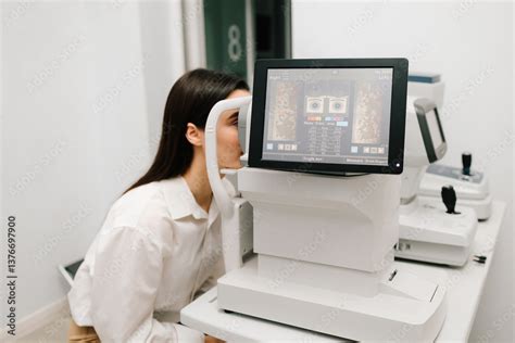 Girl Undergoes An Oct Eye Exam Using Advanced Optical Coherence Tomography Equipment The High