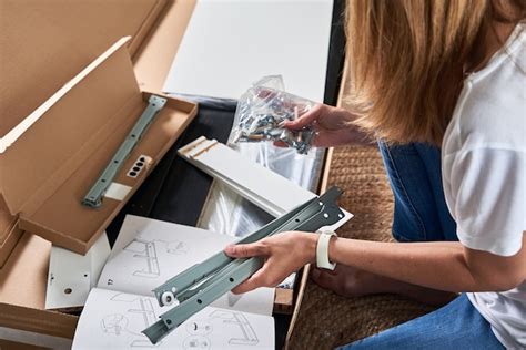Premium Photo Woman Reading Manual Instruction To Assemble Furniture