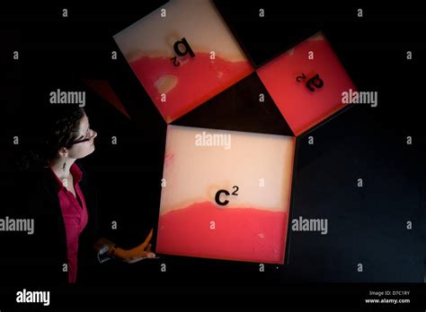 An Employee Of Turns A Display That Demonstrates The Pythagorean