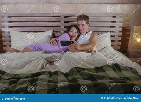 Young Attractive And Beautiful Mix Ethnicity Happy Couple With Asian