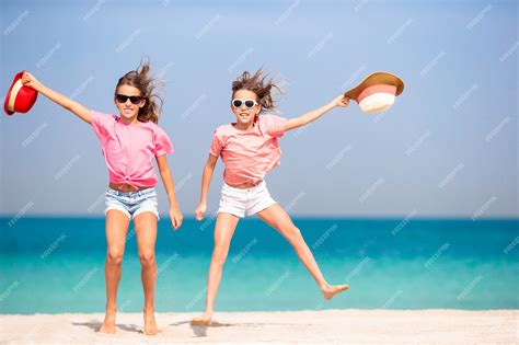 Premium Photo Little Happy Funny Girls Have A Lot Of Fun At Tropical