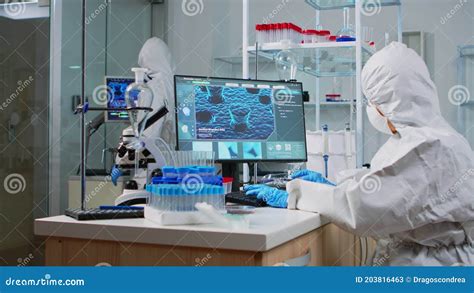 Scientist In Ppe Suit Typing Codes On Pc Stock Video Video Of