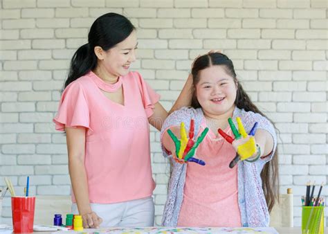 Asian Young Cute Happy Chubby Down Syndrome Autistic Daughter Showing