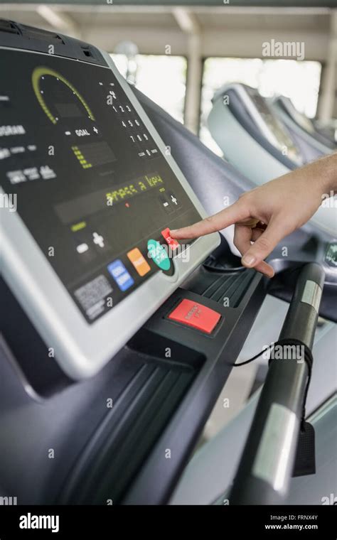 Woman Touching The Console Display Of Treadmill Stock Photo Alamy