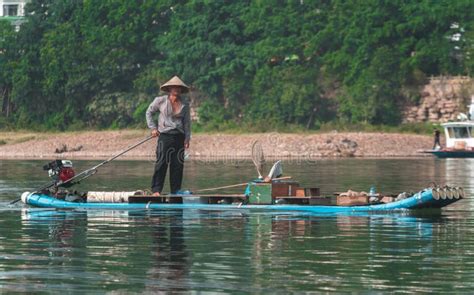 Man On The Bamboo Boat Crossing Li River In Yangshuo Editorial