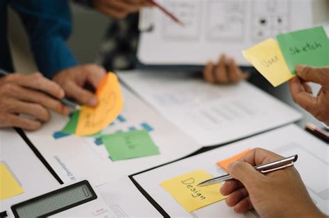 Premium Photo Ui Designer Brainstorming About Mobile App Interface
