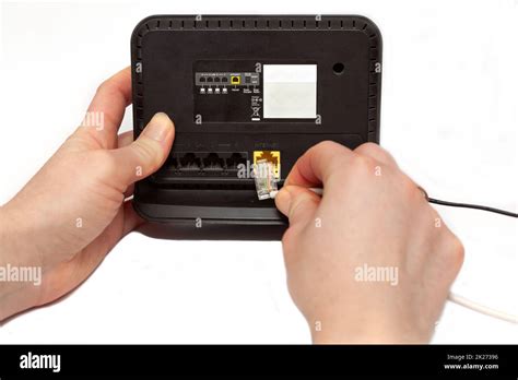 Hands Holding New Wifi Router On White Background Unpacking New Black Router Stock Photo Alamy