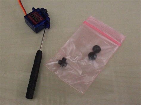 ArcBotics Repairing Hexy Servo Gears