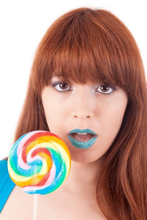 Beautiful Woman Eating Lollipop Photo Background And Picture For Free