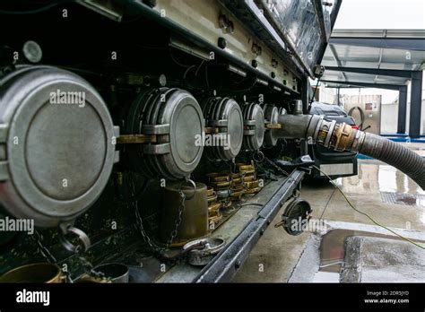 Unloading Of Fuels Spouts Of A Fuel Tanker Unloading At A Service Station Stock Photo Alamy