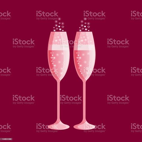 Two Glasses Of Pink Champagne With Bubbles Isolated On A Maroon