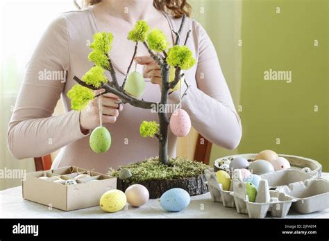 Florist At Work Woman Shows How To Make Easter Decoration In Tree