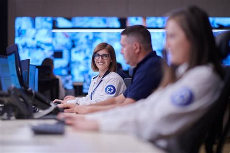 Premium Photo Group Of Security Data Center Operators Working In A