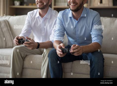Cheerful Positive Adult Similar Twins Playing Video Game Stock Photo Alamy