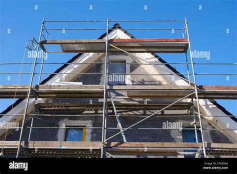 House Gable With Scaffolding Building Site In A New Housing Estate