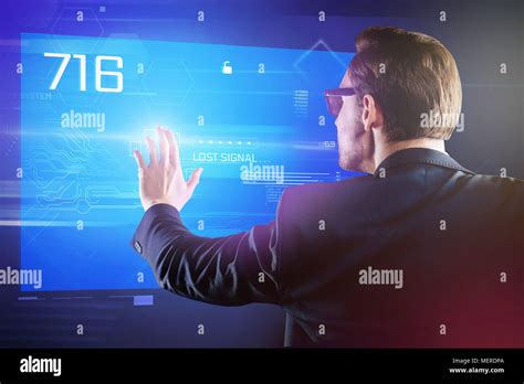 Attentive Programmer Carefully Touching The Screen Of His Futuristic