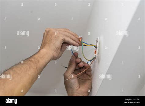 Electrician Wiring A Socket In The House Electrician Electrical Connection And Cables Close