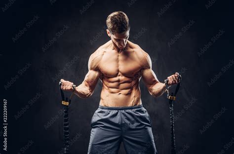 Handsome Shirtless Man With Stylish Hair And Muscular Ectomorph Doing The Exercises With An