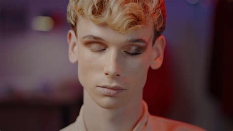 Young Non Binary Individual Applying Makeup Stock Footage Sbv 347697760