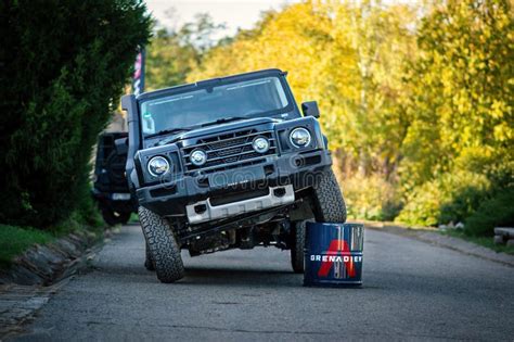 The Rugged Off Road Car Stands On An Iron Barrel Editorial Stock Image