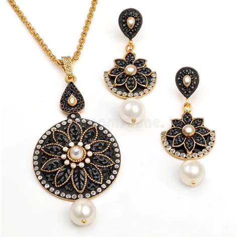 Black And Gold Jewelry Collection With Pearl Accents Isolated On White