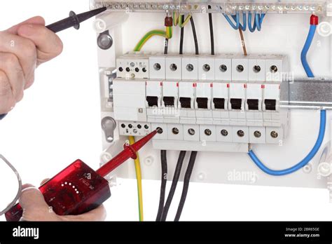 Electrician Is Testing The Voltage With Tester Stock Photo Alamy