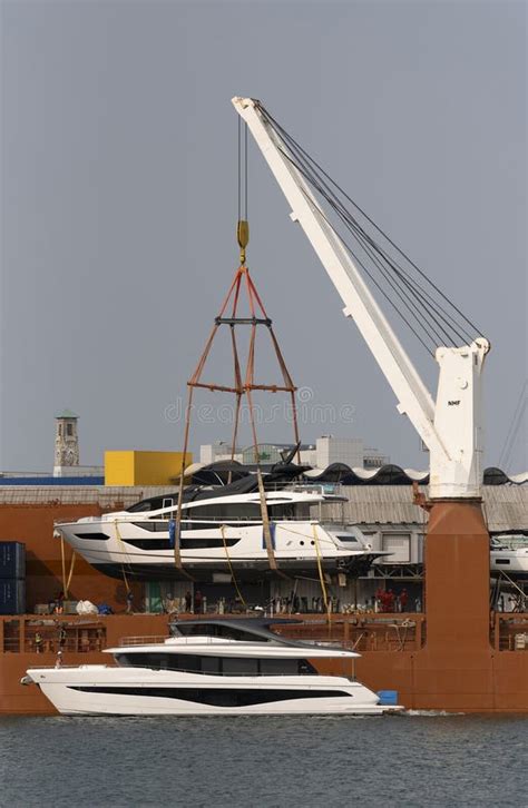 Unloading Motor Yachts From A Cargo Ship In Southampton Docks Uk