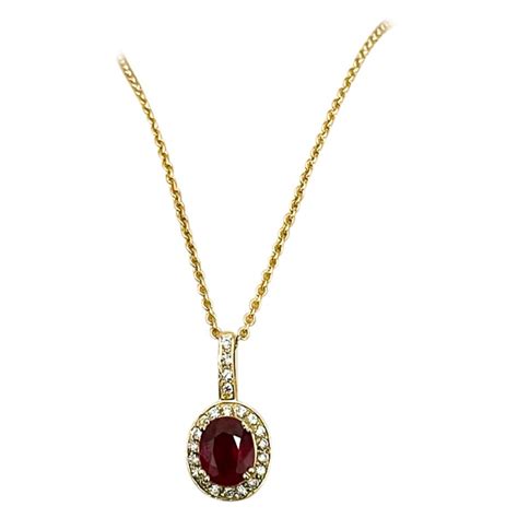 35 Carat Oval Cut Ruby Pendant With Diamonds 14 Karat Yellow Gold