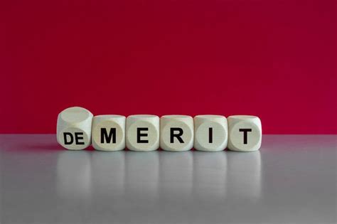 Premium Photo Demerit Or Merit Symbol Turned A Wooden Cube And