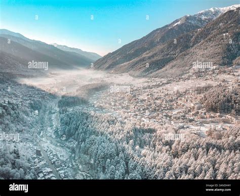 Early Morning Aerial View Of Snow Covered Manali City In Himachal