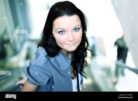 Woman On Escalator Stock Photo Alamy